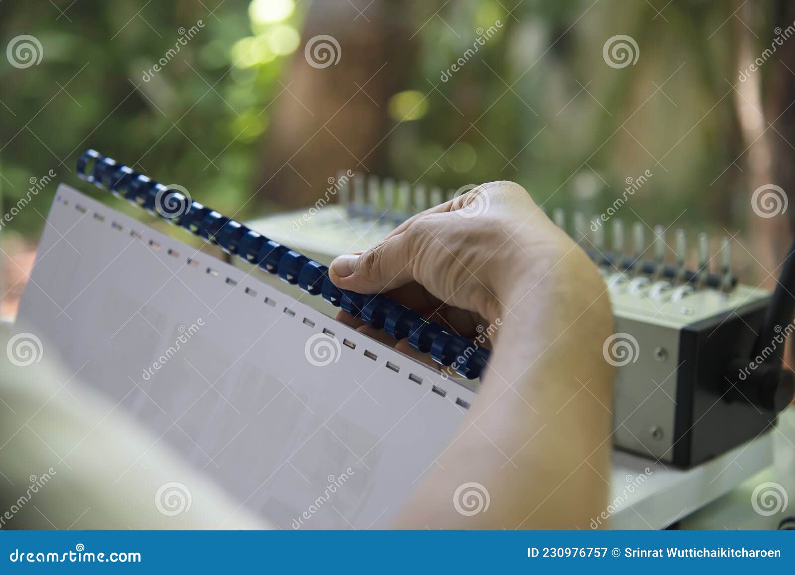 Man Making Report Using Comb Binding Machine Stock Image - Image of ...