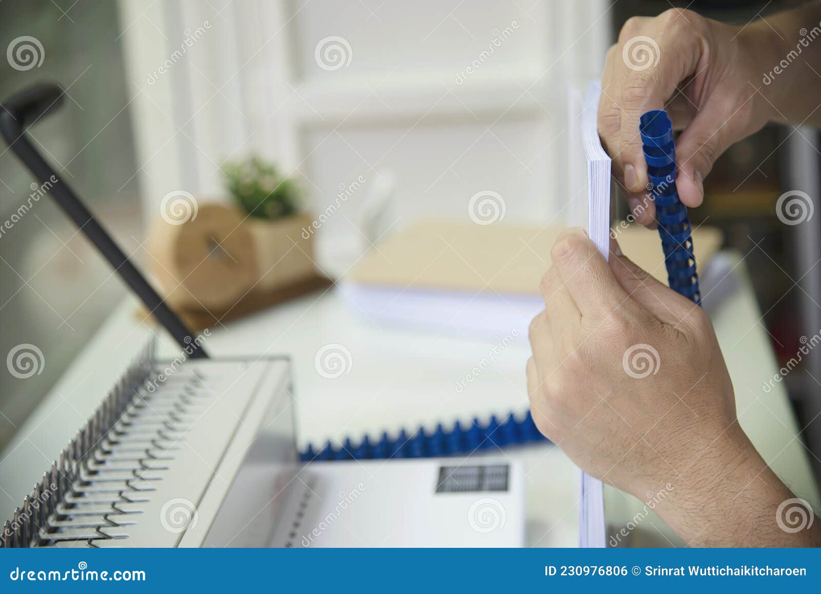 Man Making Report Using Comb Binding Machine Stock Photo - Image of ...