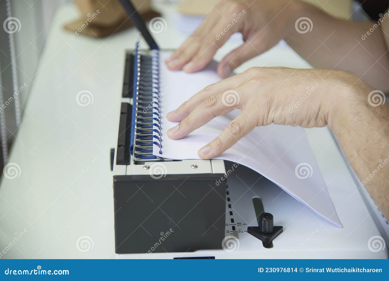 Man Making Report Using Comb Binding Machine Stock Photo - Image of ...