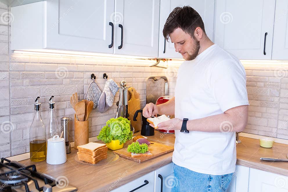 Man Making Sandwich on the Kitchen Stock Photo - Image of lettuce ...