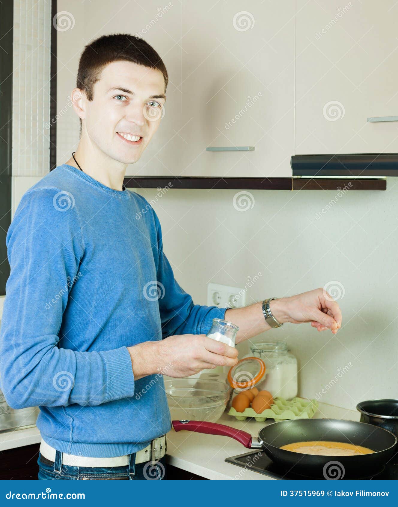 Man Making Scrambled Eggs in Frying Pan Stock Image - Image of interior ...