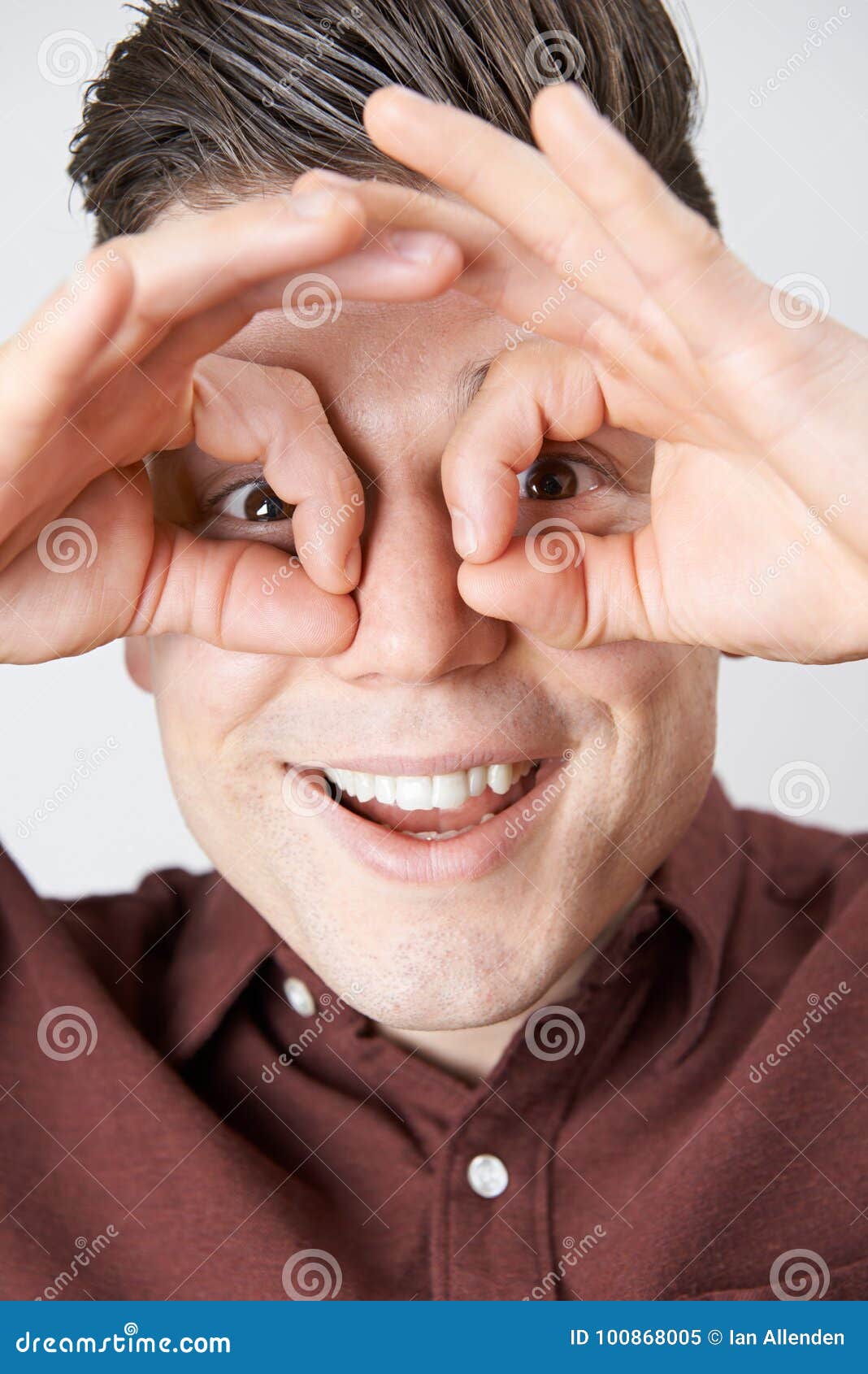 Studio Shot of Man Making Spectacle Shape with His Hands Stock Image ...