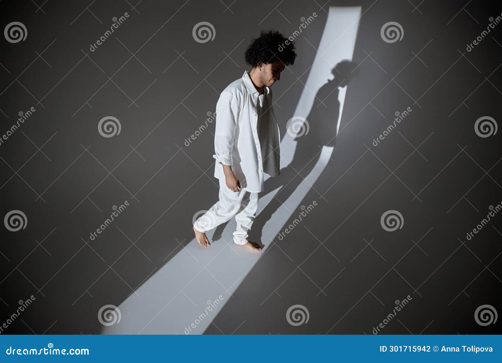 Man Making Step into Light from Darkness Stock Photo - Image of ...