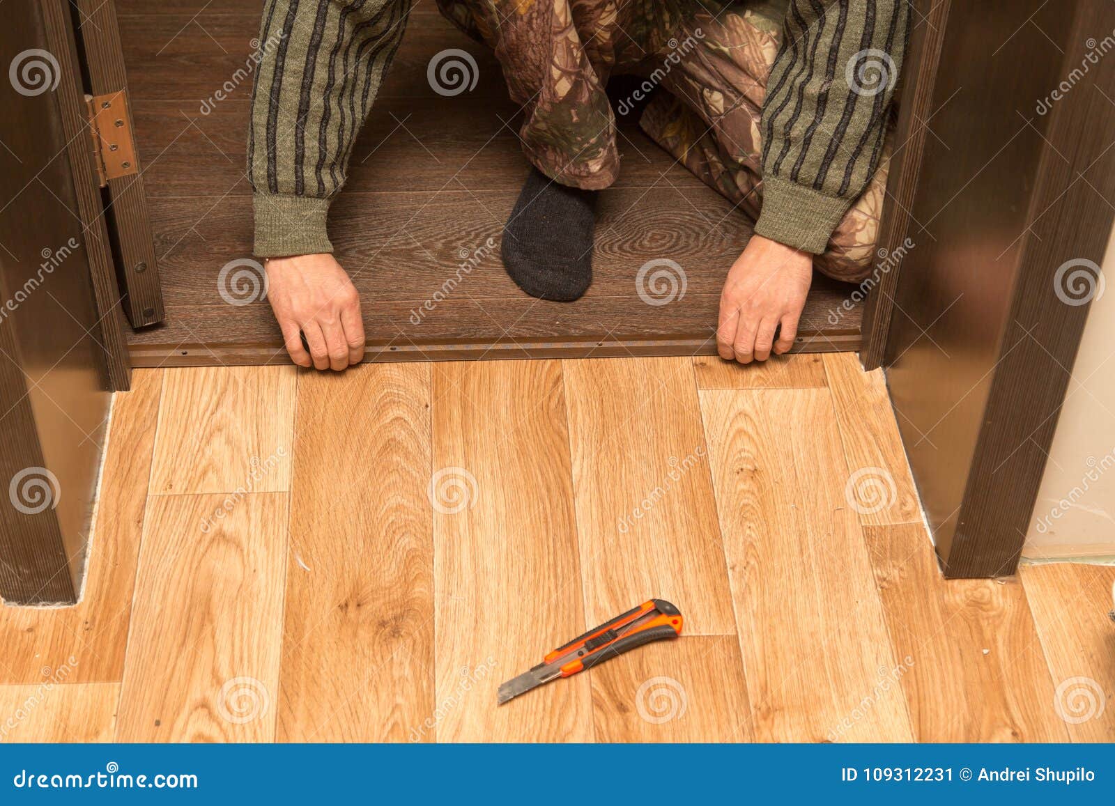 A Man is Making a Threshold on the Floor Stock Image - Image of wood ...