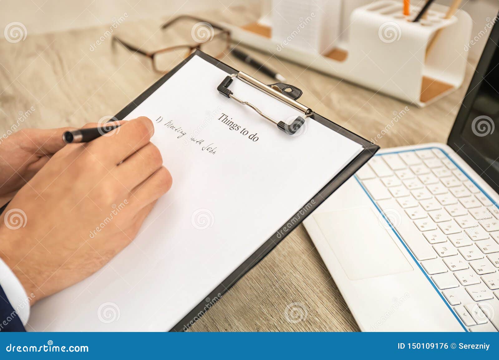 Man Making To-do List while Sitting at Table, Closeup Stock Photo ...