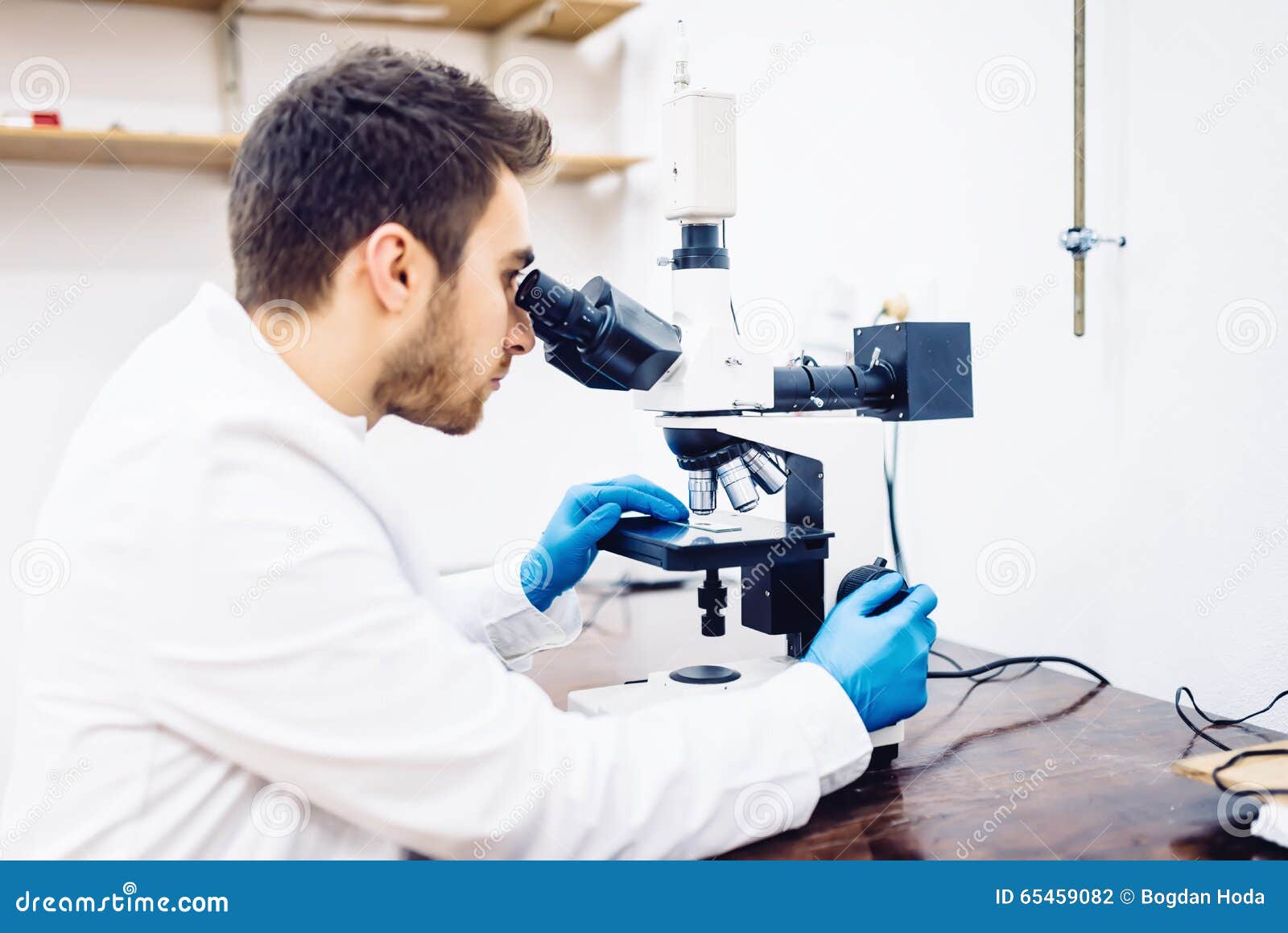 Man, Male Scientist, Chemist Working with Microscope in Pharmaceutical ...