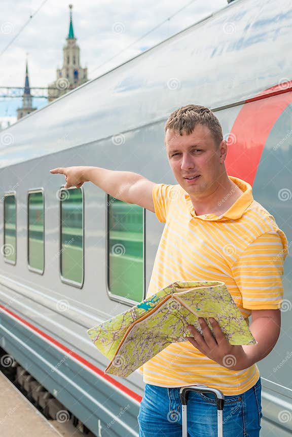 Man with a Map in Hand Shows the Direction Stock Image - Image of ...