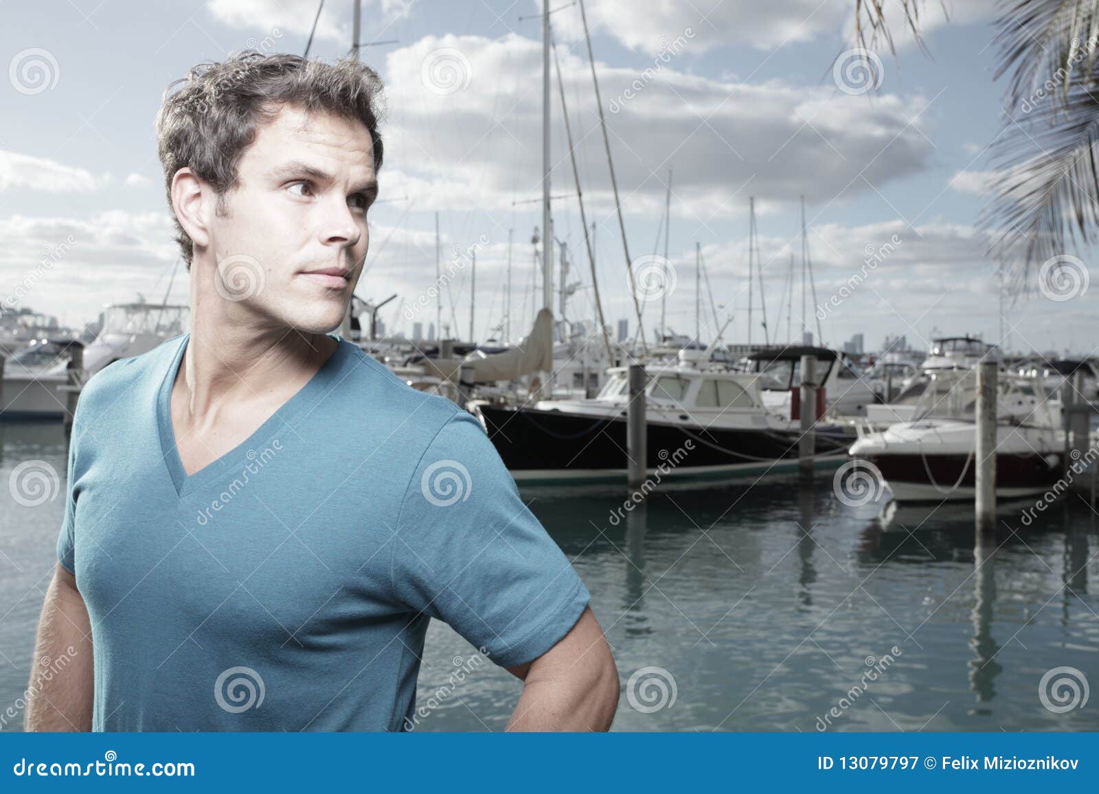 Man at a Marina Glancing Over His Shoulder Stock Image - Image of blue ...