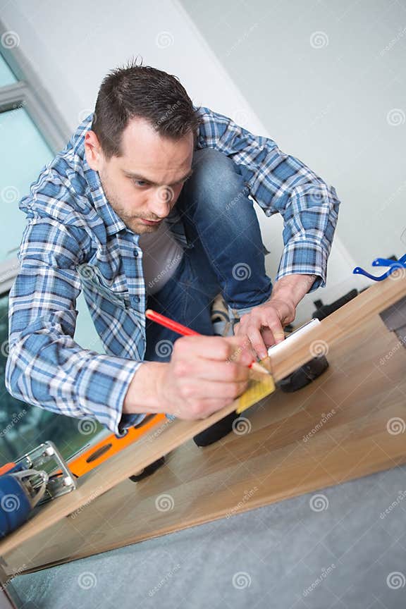 Man Marking Position on Floorboard Stock Photo - Image of renovation ...