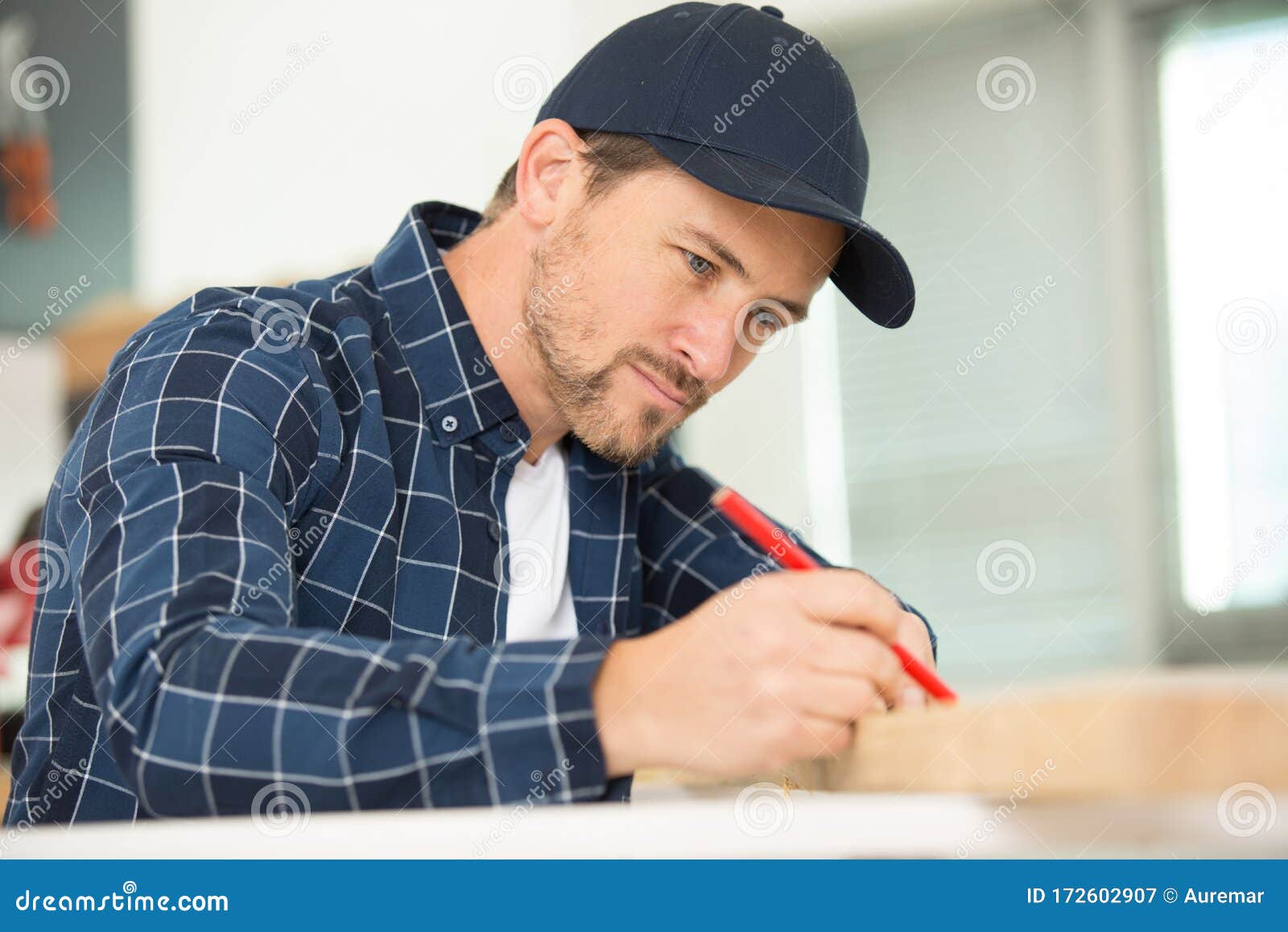 Man Marking Wood with Pencil Stock Image - Image of germany, carpenter ...