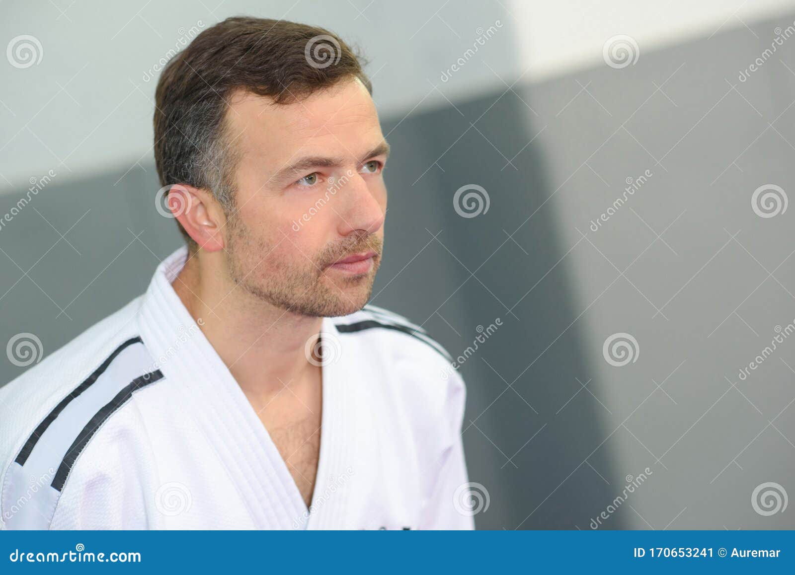 Man in martial arts robe stock image. Image of concentrate - 170653241