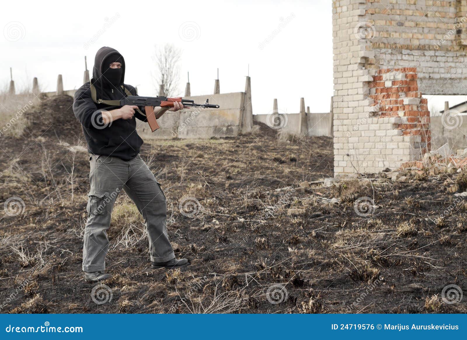 Man in mask with gun stock photo. Image of firefight - 24719576