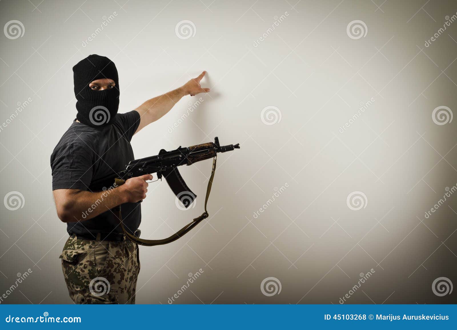 Man in mask with gun stock photo. Image of escape, draw - 45103268