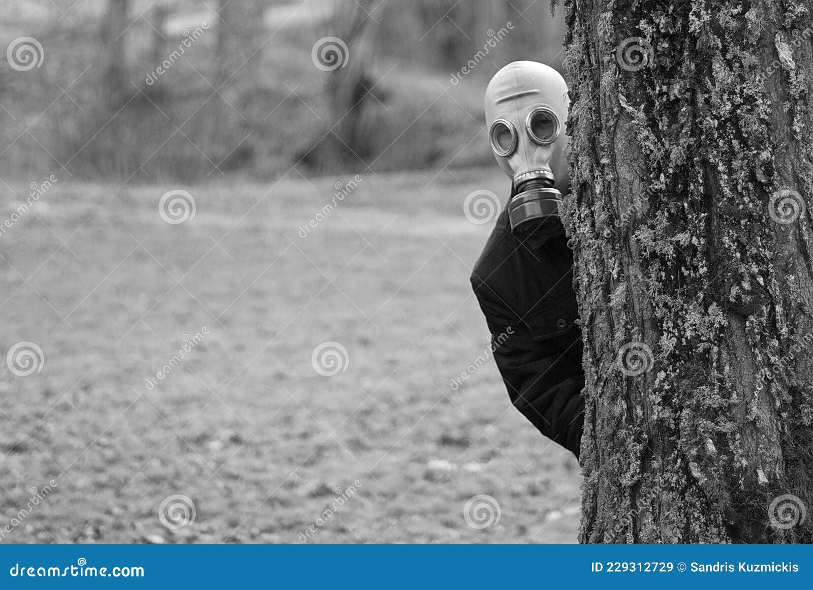 A Man with a Mask is Hiding Behind a Tree. Covid-19 Stock Image - Image ...