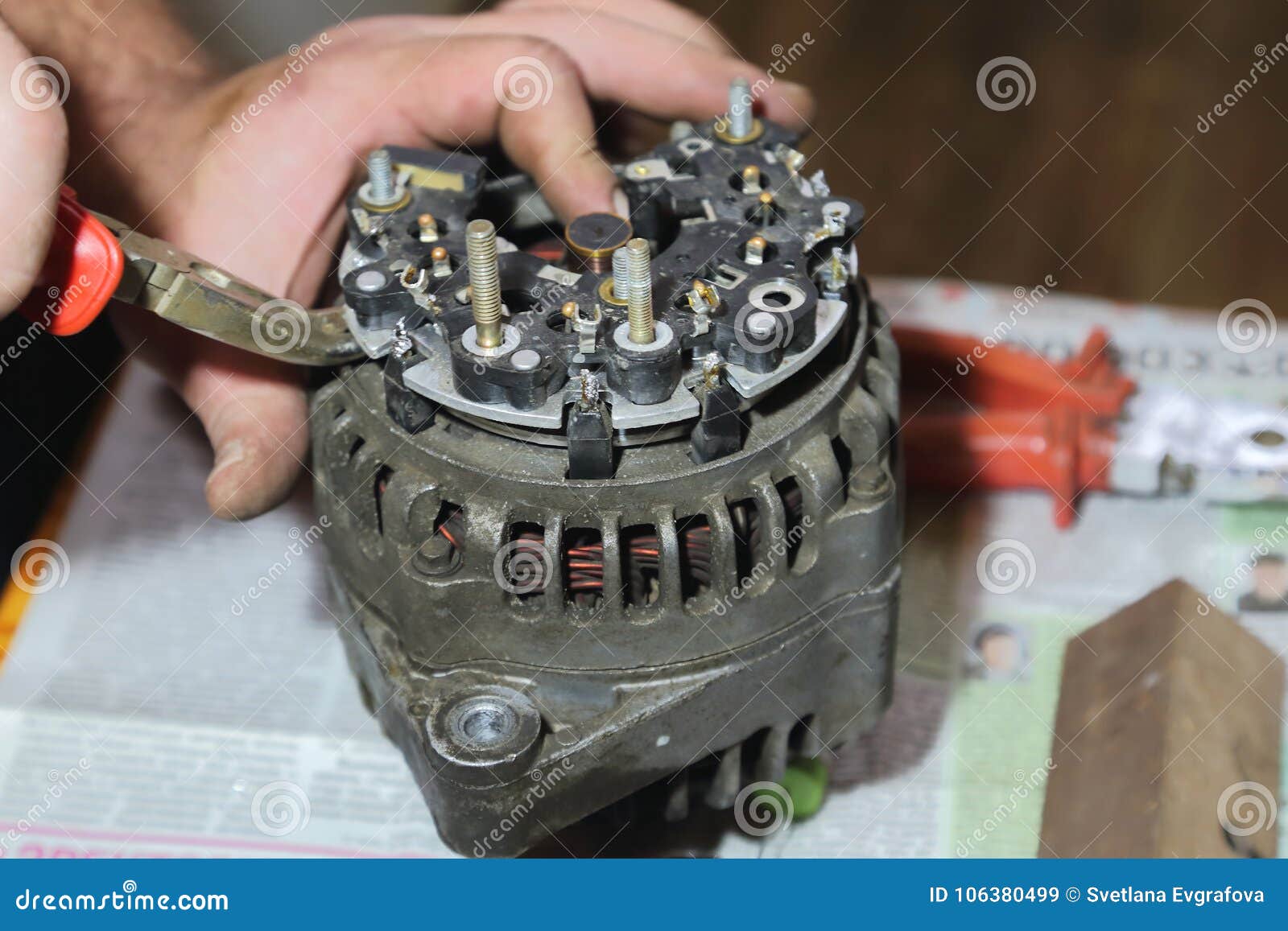 The Master Man Repairs the Old Car Generator at Home. Stock Image ...