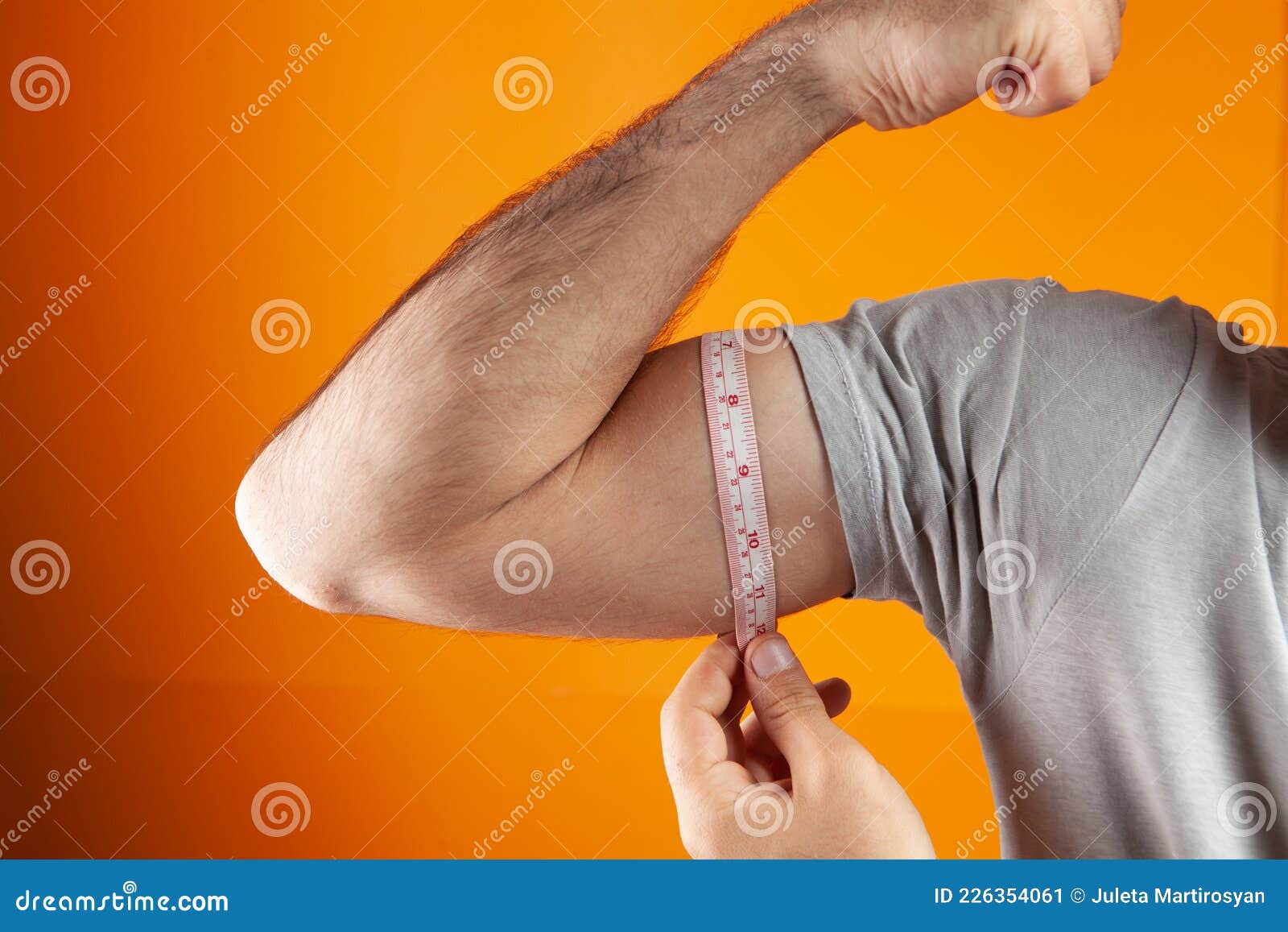 A Man Measures the Girth of His Arm with a Meter Stock Image - Image of ...