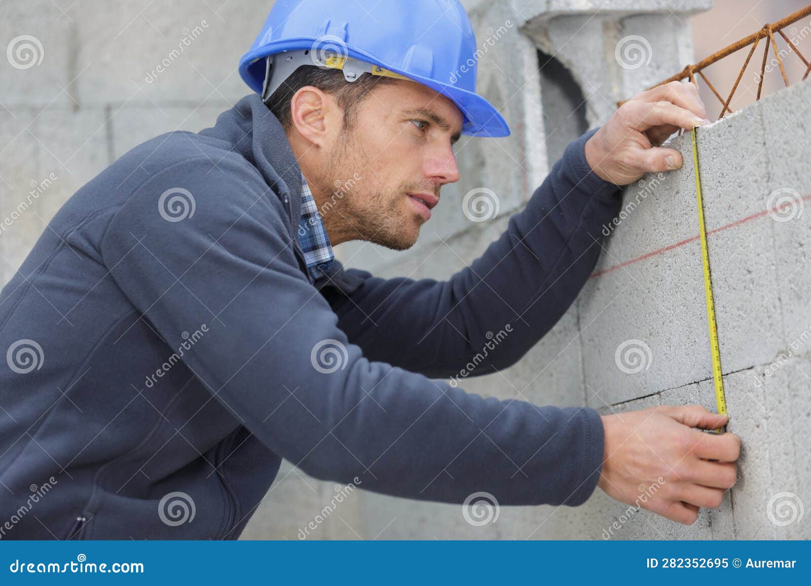 Man Measures on Wall with Ruler Stock Image - Image of renovation, wall ...