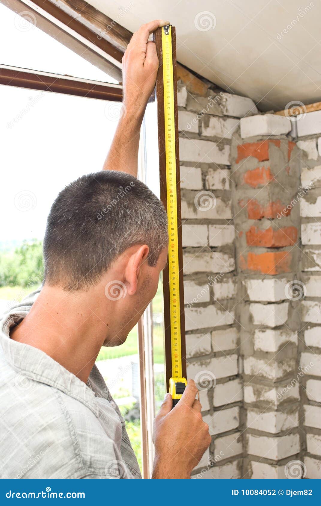 Man measures window stock photo. Image of house, window - 10084052