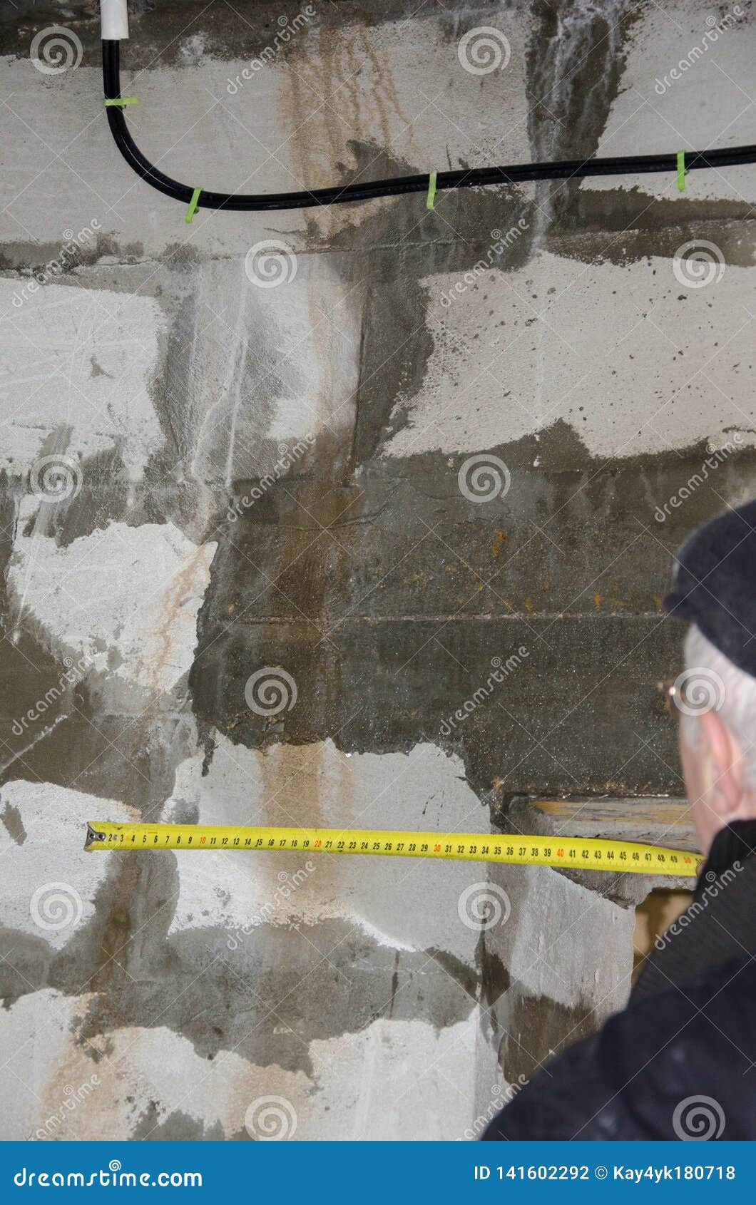 A Man Measures the Wiring, Accuracy is Important Stock Photo - Image of ...