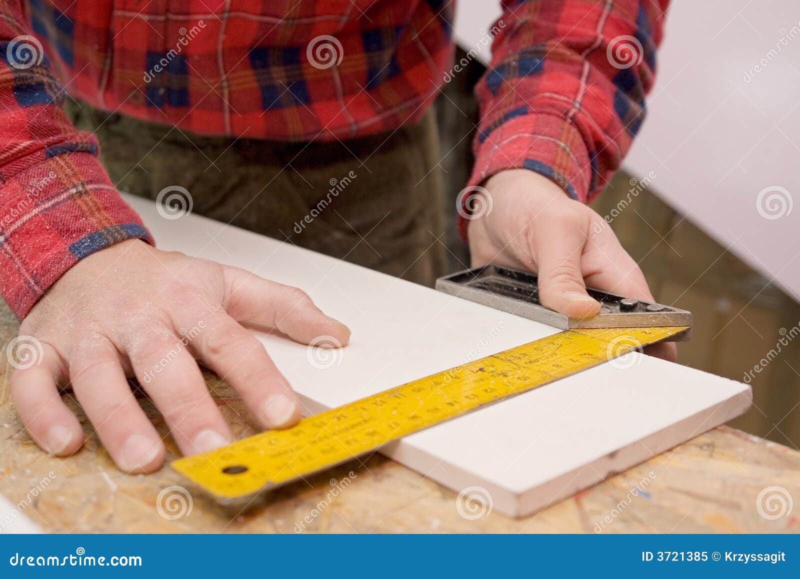 Man Measuring a Board stock image. Image of determine - 3721385