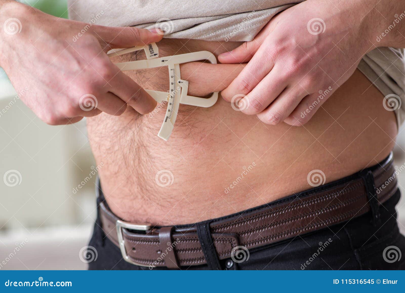 The Man Measuring Body Fat with Calipers Stock Image - Image of extra ...