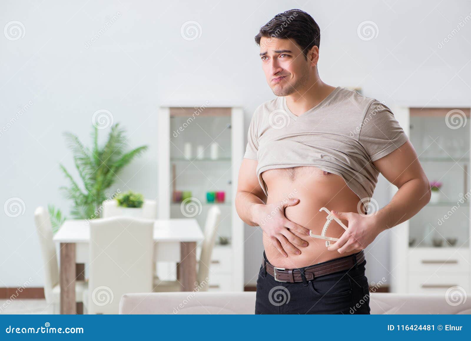 The Man Measuring Body Fat with Calipers Stock Image - Image of ...