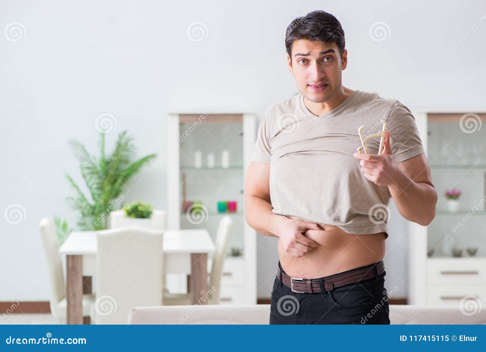 The Man Measuring Body Fat with Calipers Stock Image - Image of abdomen ...