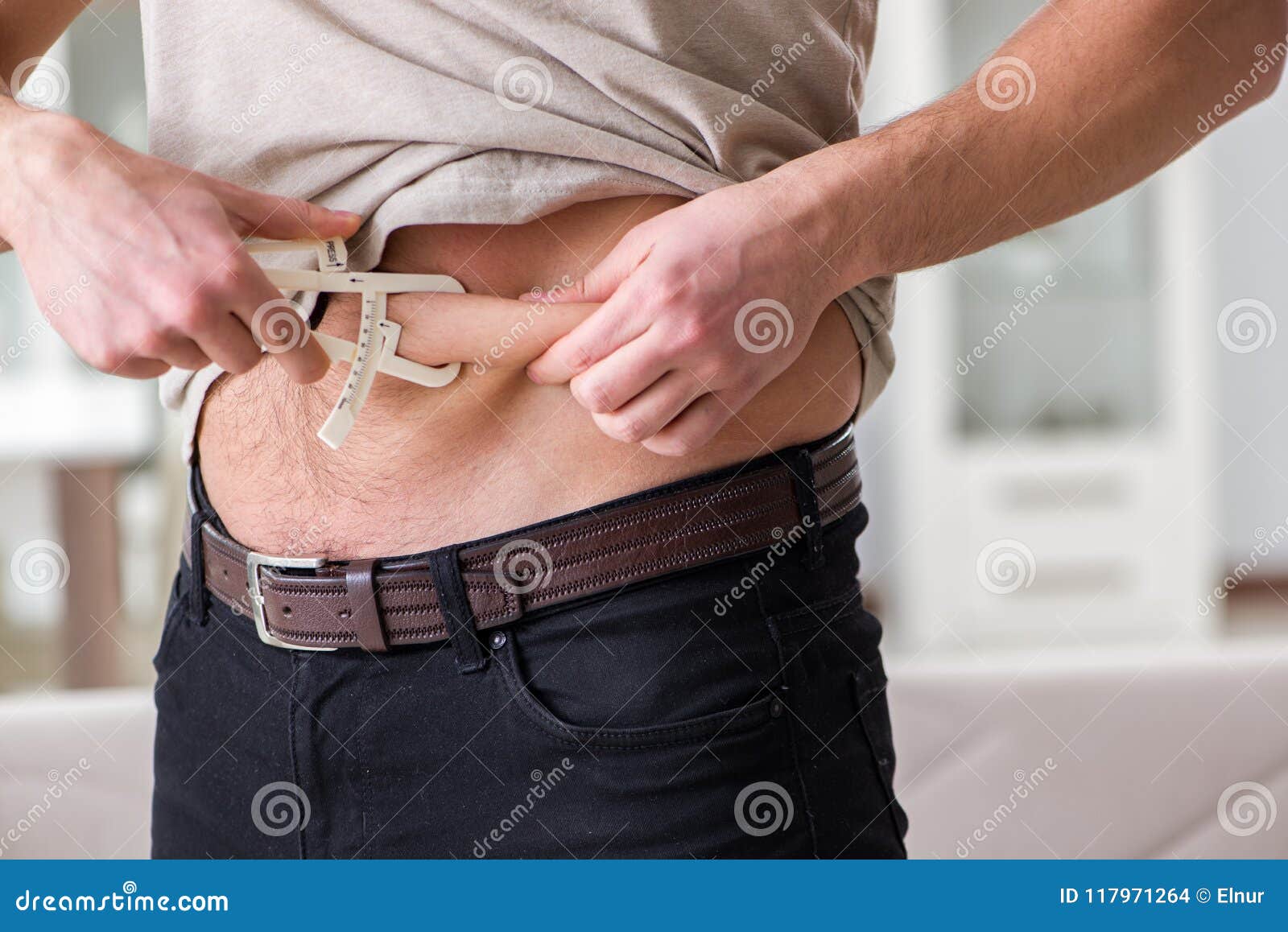 The Man Measuring Body Fat with Calipers Stock Photo - Image of ...