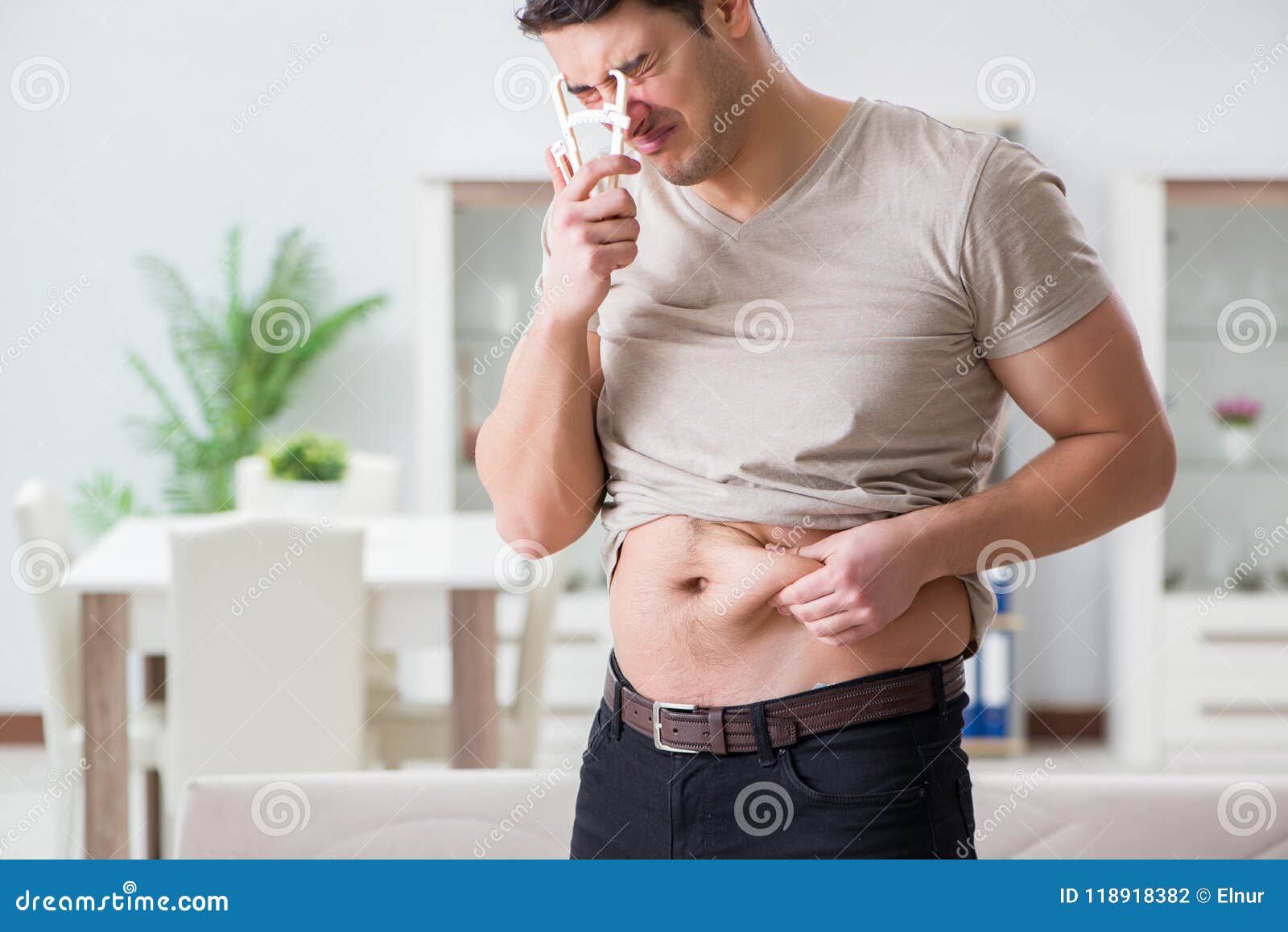 The Man Measuring Body Fat with Calipers Stock Photo - Image of extra ...