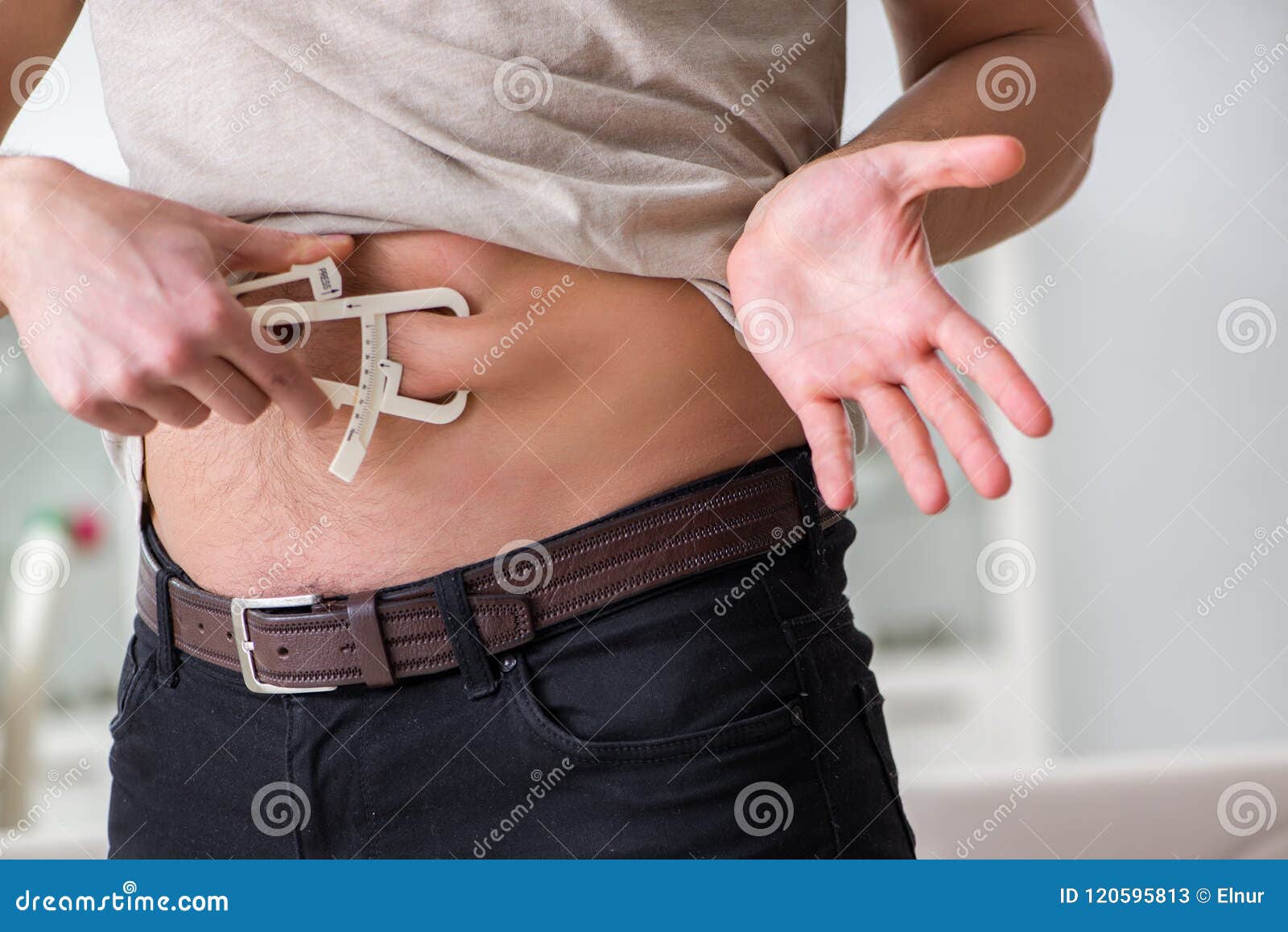 The Man Measuring Body Fat with Calipers Stock Image - Image of ...