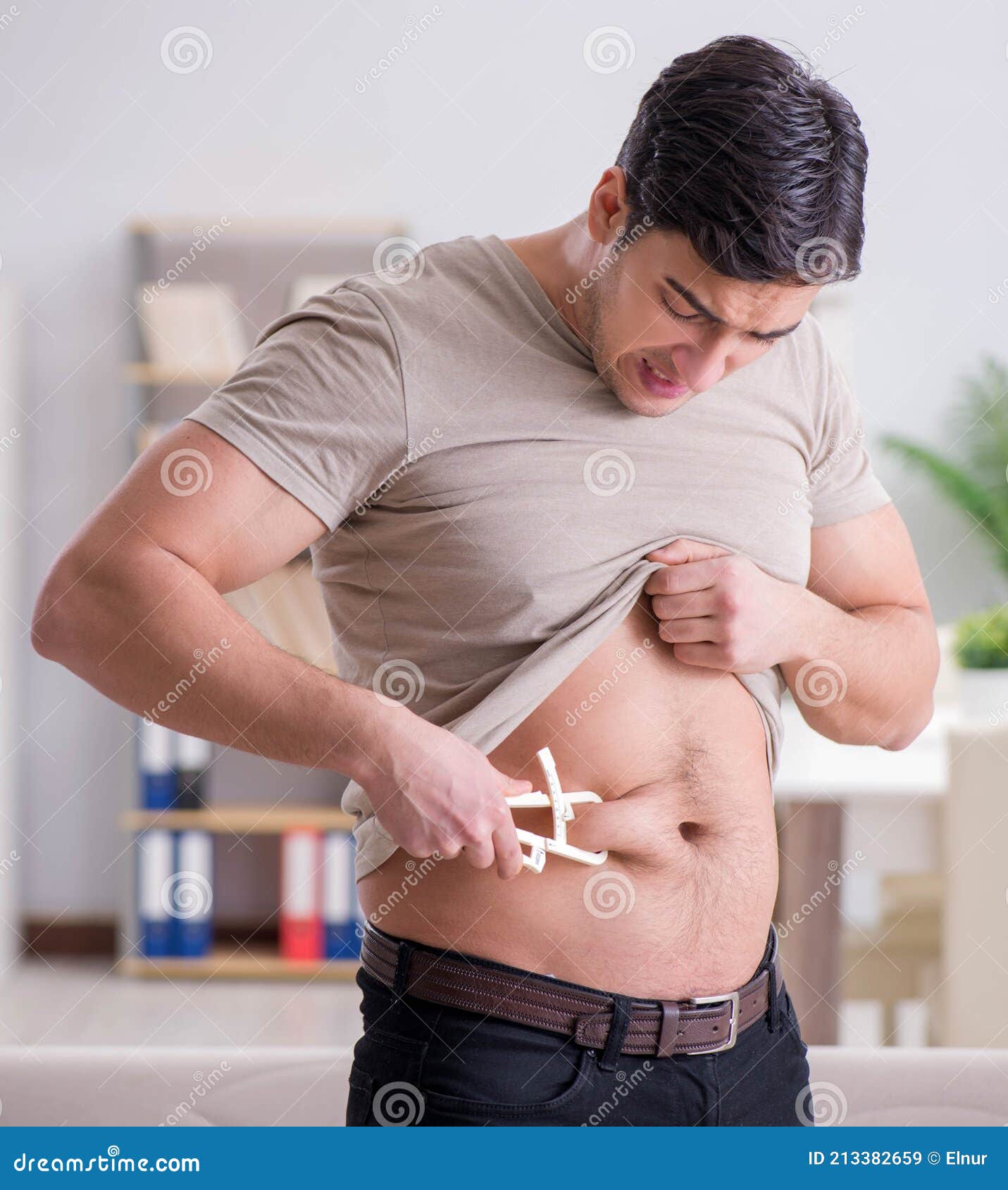 Man Measuring Body Fat with Calipers Stock Image - Image of excessive ...