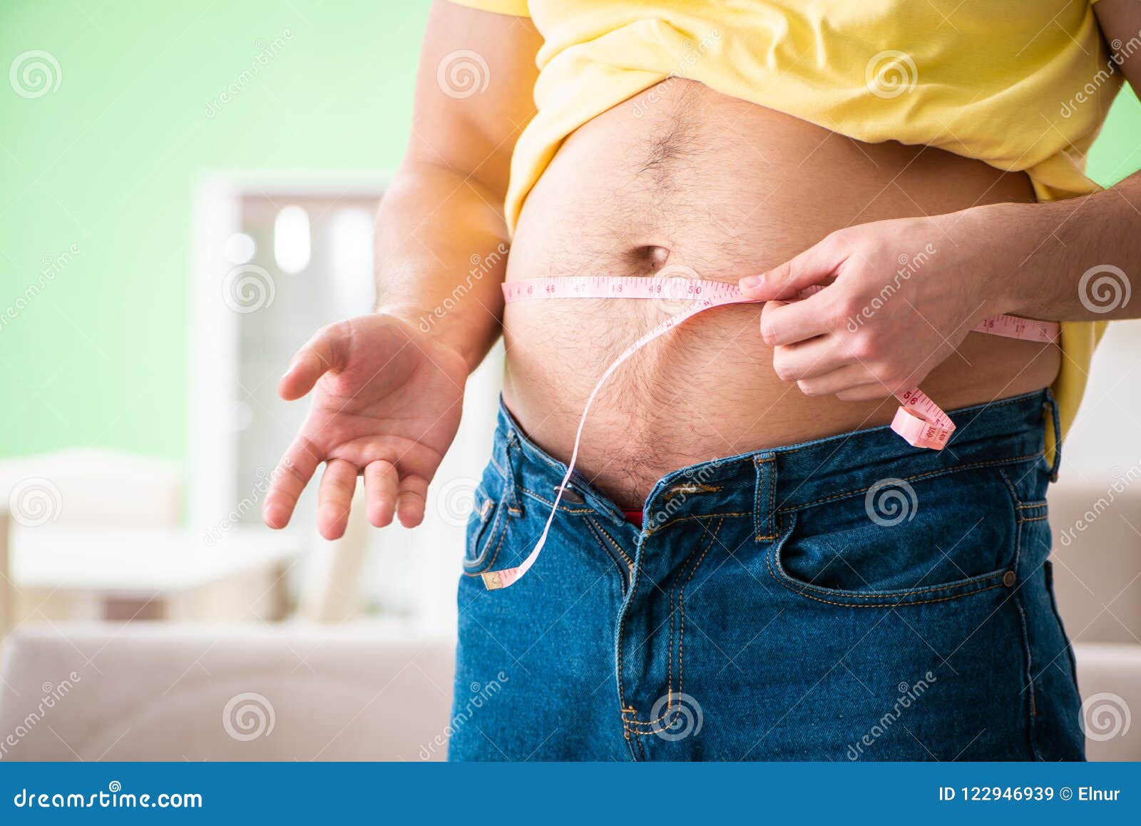 The Man Measuring Body Fat with Tape Measure in Dieting Concept Stock ... The Man Measuring Body Fat with Tape Measure in Dieting Concept Stock ...