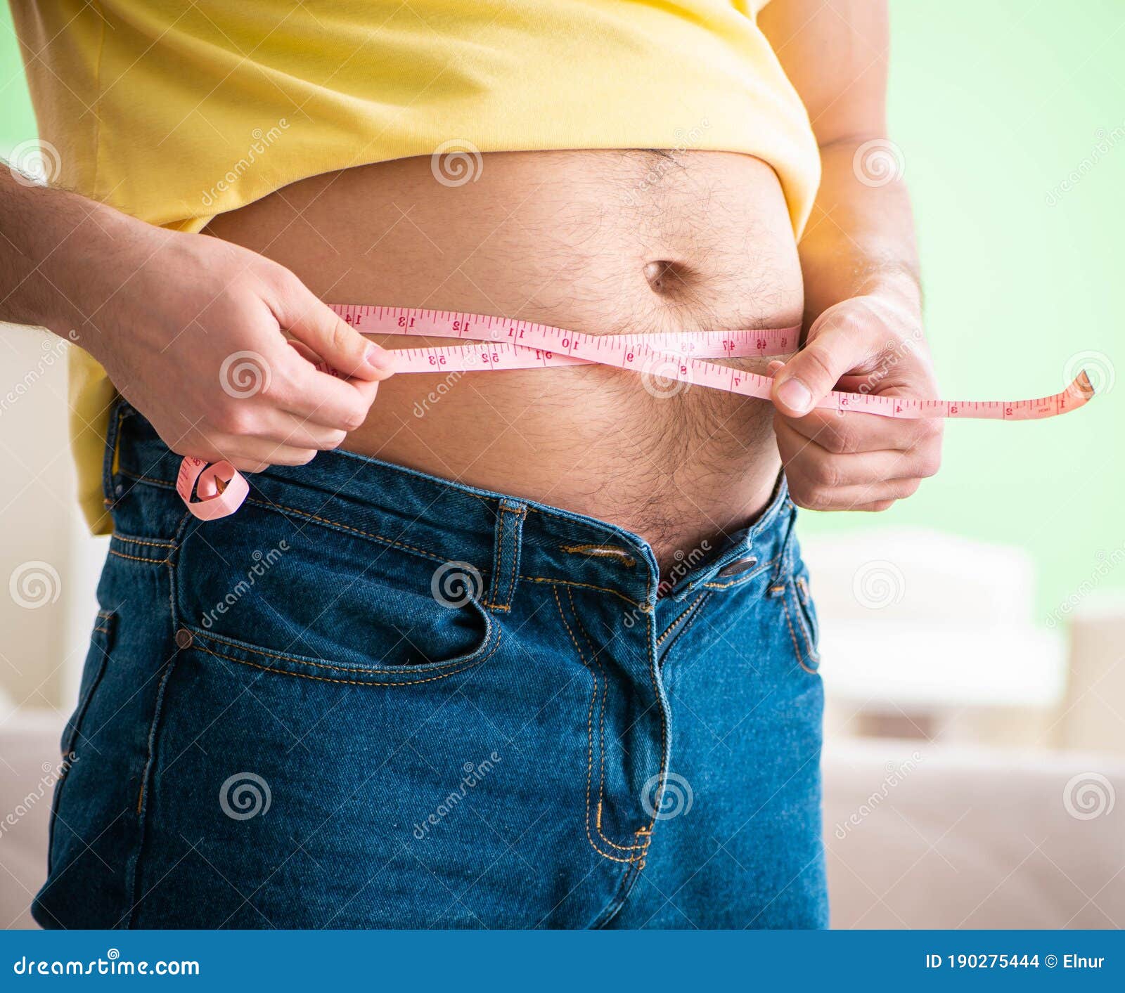 Man Measuring Body Fat with Tape Measure in Dieting Concept Stock Photo ... Man Measuring Body Fat with Tape Measure in Dieting Concept Stock Photo ...