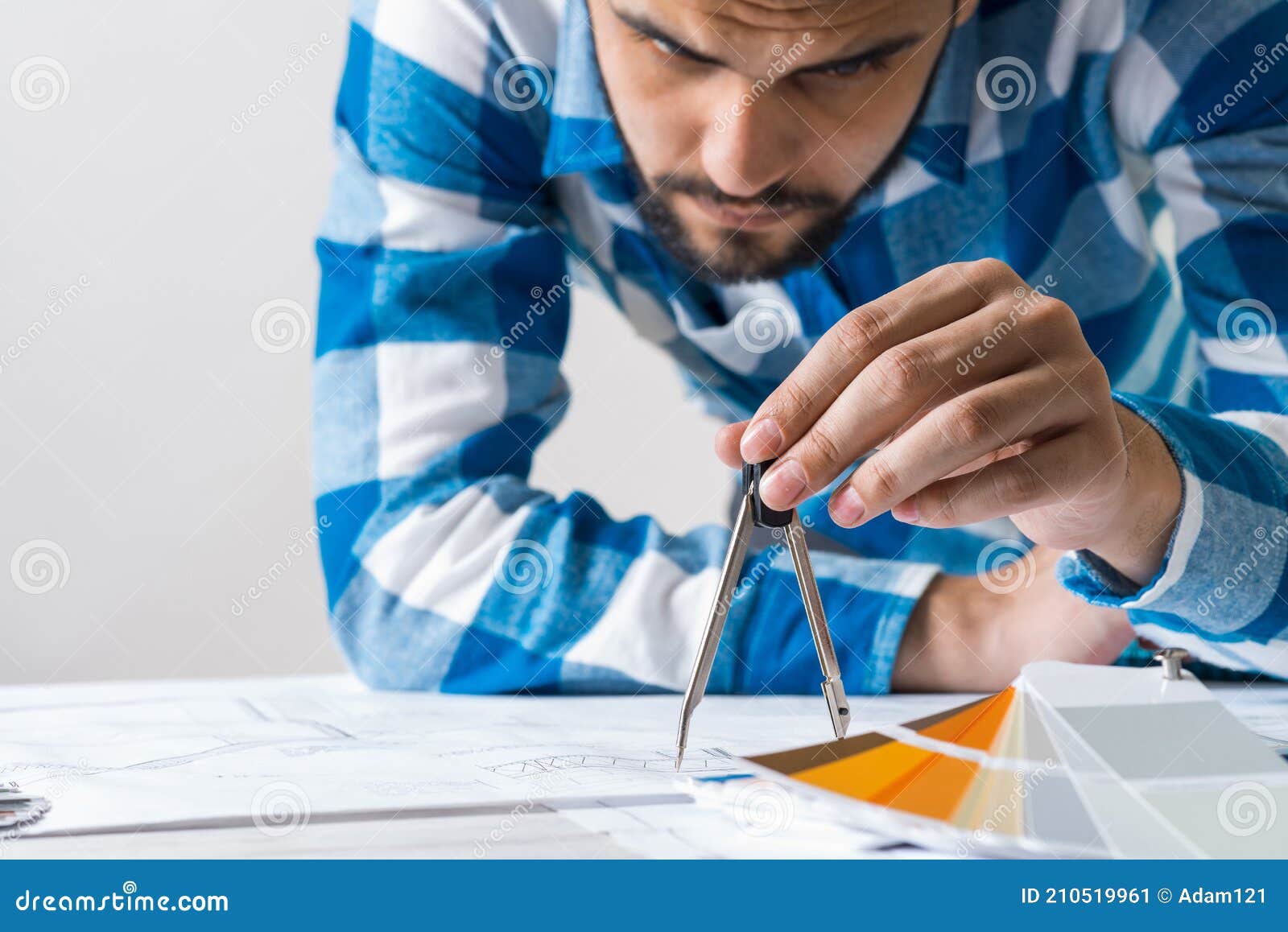 Man Measuring with Compass Divider on Blueprint Stock Image - Image of ...