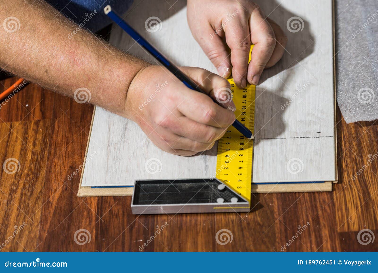 Man measuring floor panels stock image. Image of home - 189762451