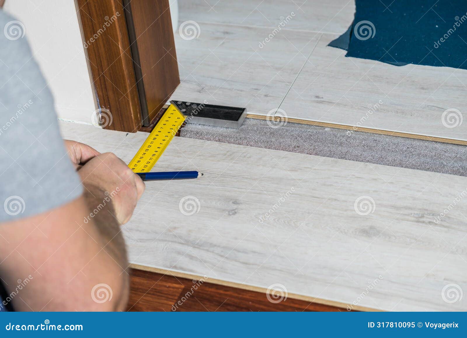 Man measuring floor panels stock image. Image of flooring - 317810095