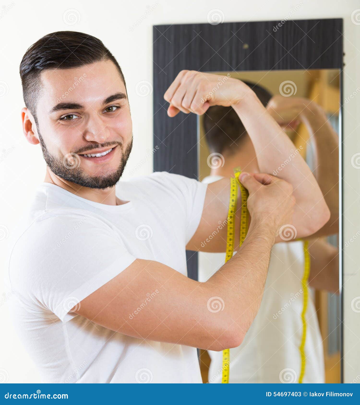 Man Measuring His Bicep and Body Stock Image - Image of attractive ...