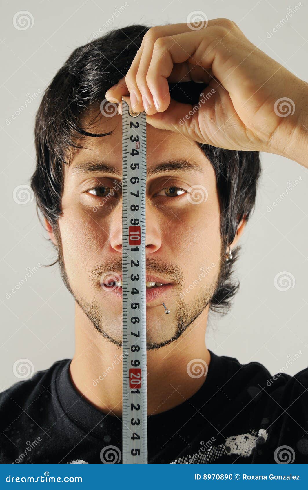 Man measuring his face stock photo. Image of holding, hand - 8970890