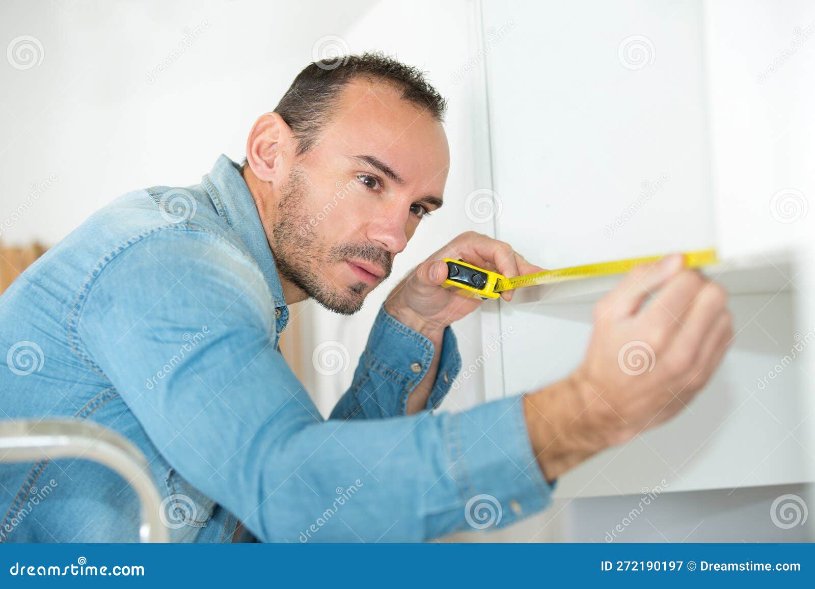 Man Measuring Kitchen Cupboard Stock Image - Image of handyman ...