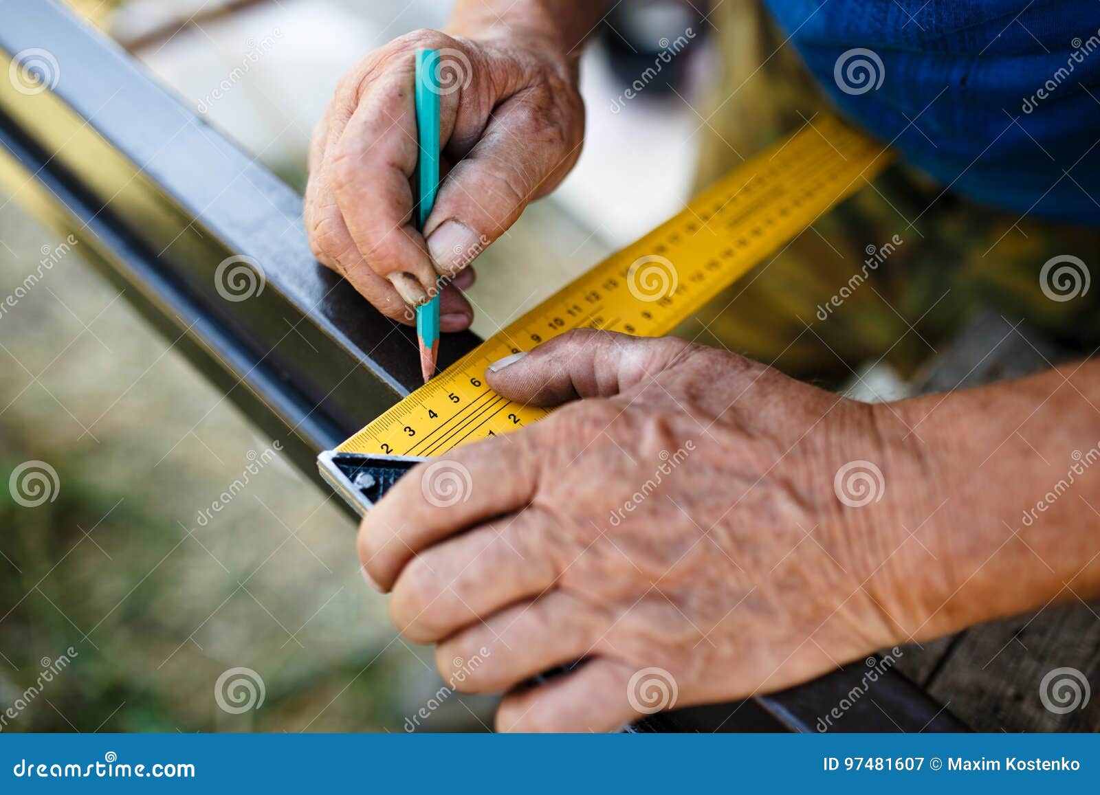 Man Measuring Off Metal Bar in Workshop. Stock Image - Image of ...