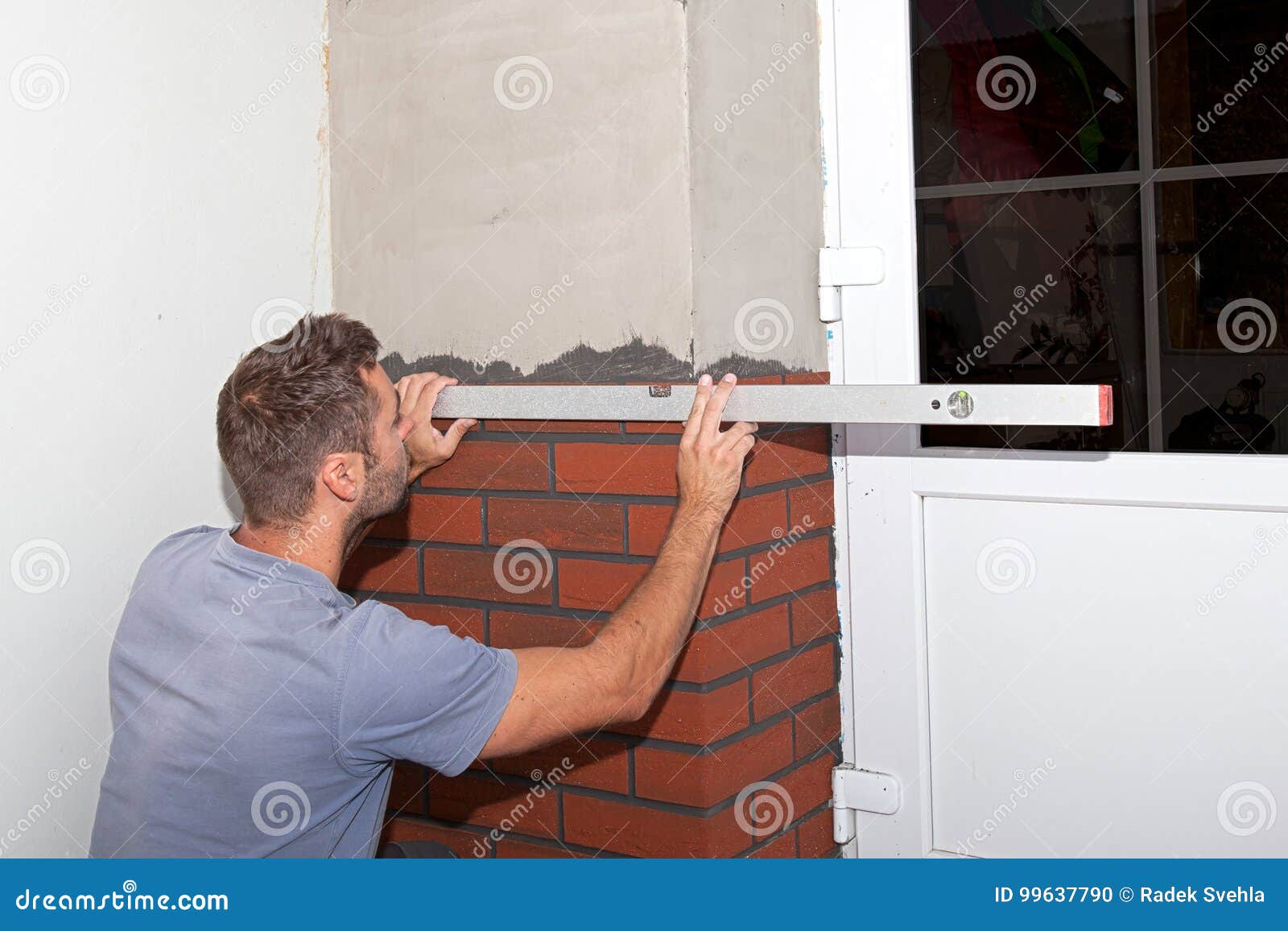Worker Stuck Stone Cladding On The Facade. Stock Image | CartoonDealer ...