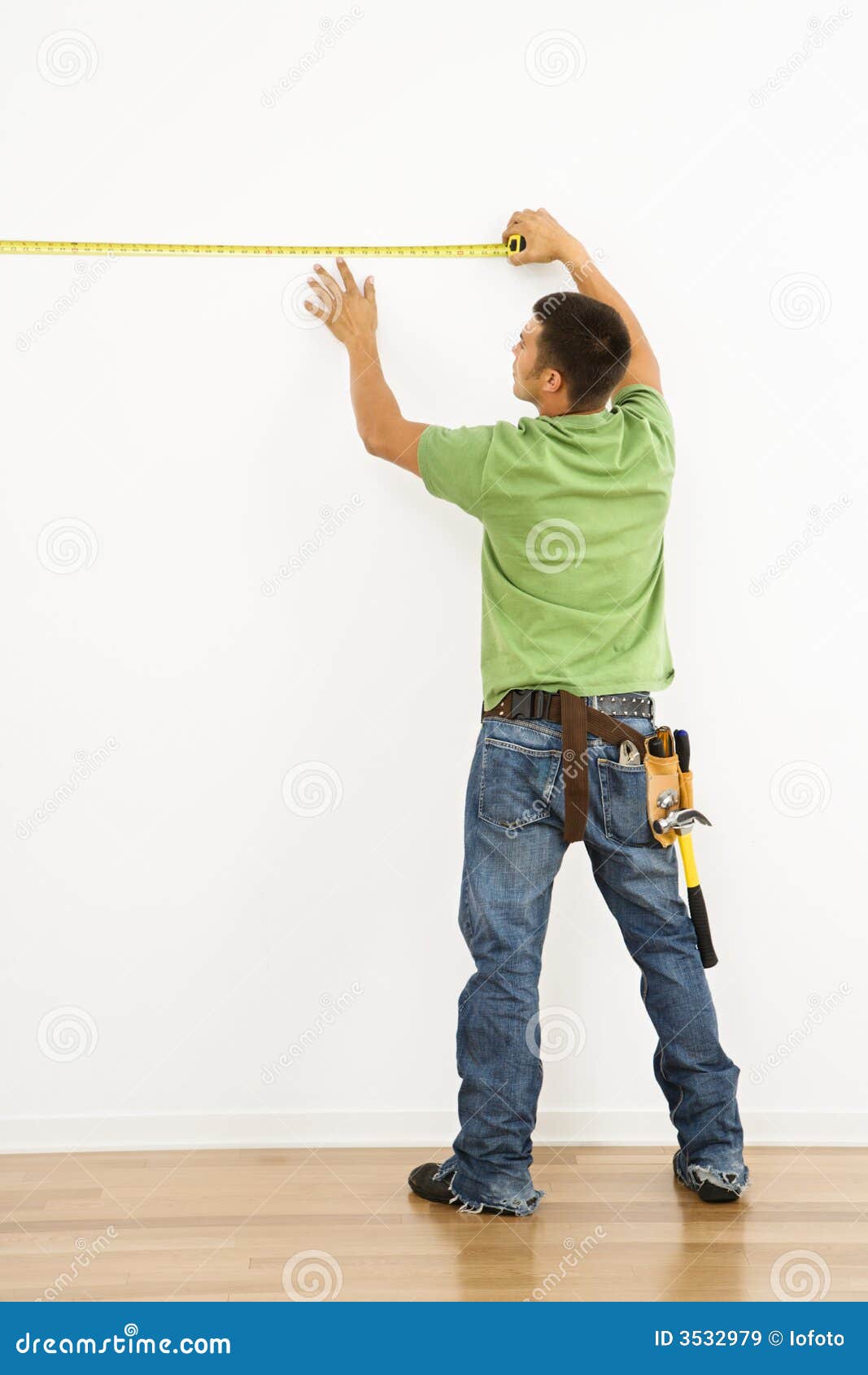 Man measuring wall. stock image. Image of construction - 3532979