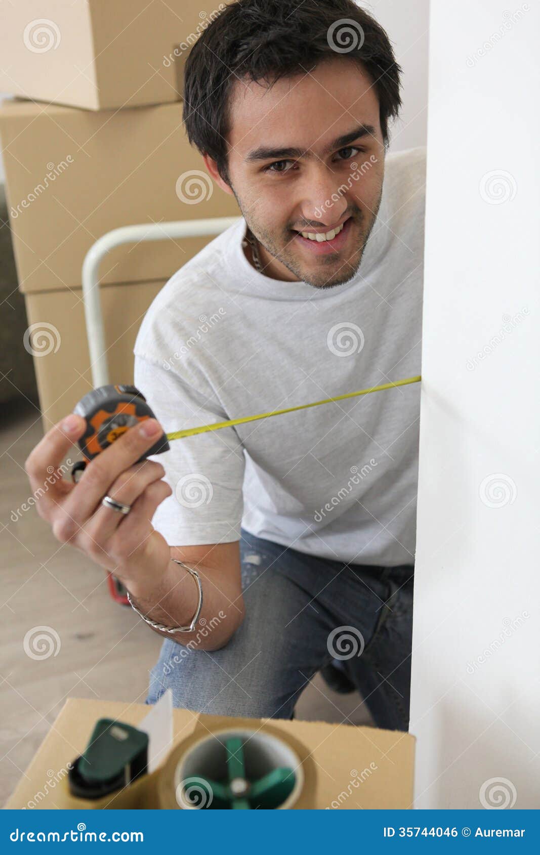 Man measuring wall stock photo. Image of meter, flat - 35744046