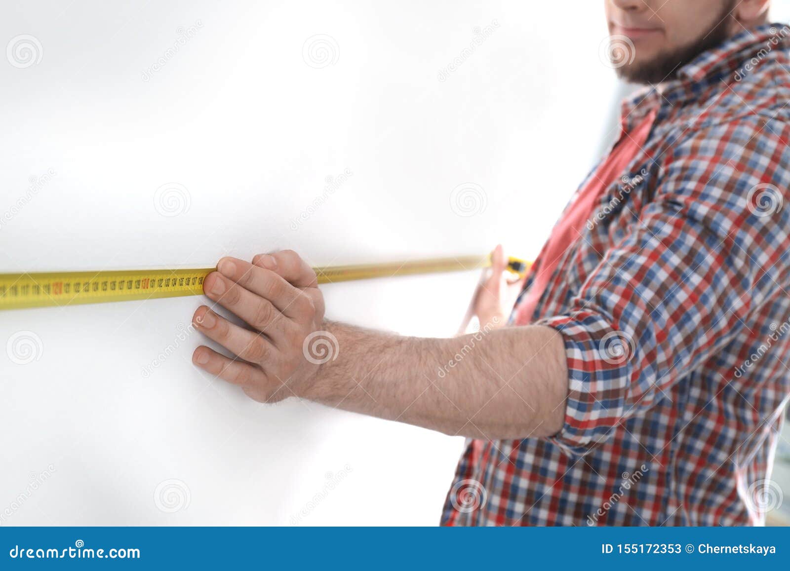 Man Measuring White Wall, Closeup. Tool Stock Image - Image of ...
