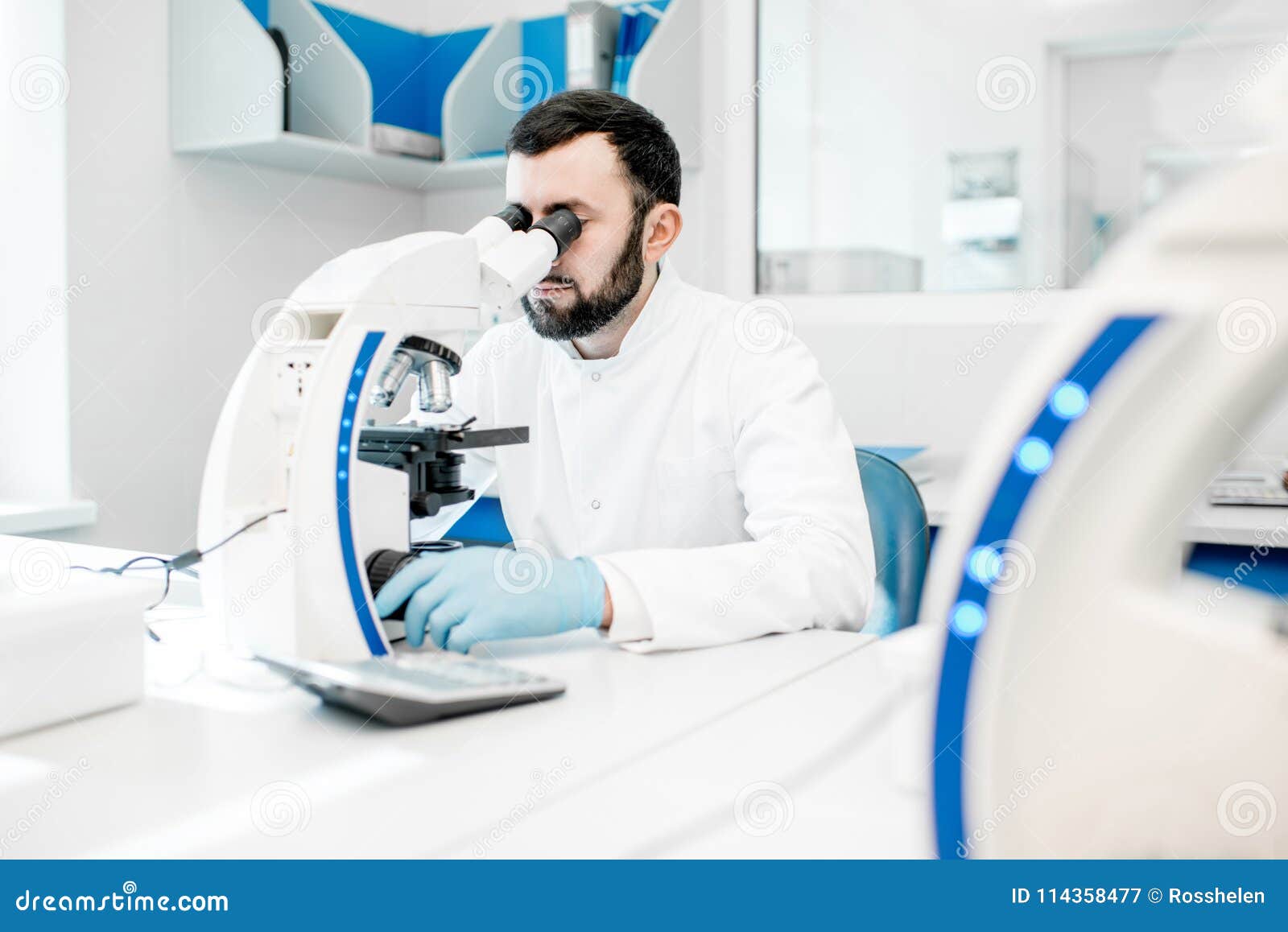Medic Working with Microscope at the Laboratory Stock Image - Image of ...
