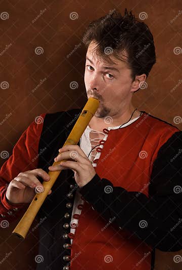 Man in a Medieval Suit Plays a Flute Stock Image - Image of minstrel ...