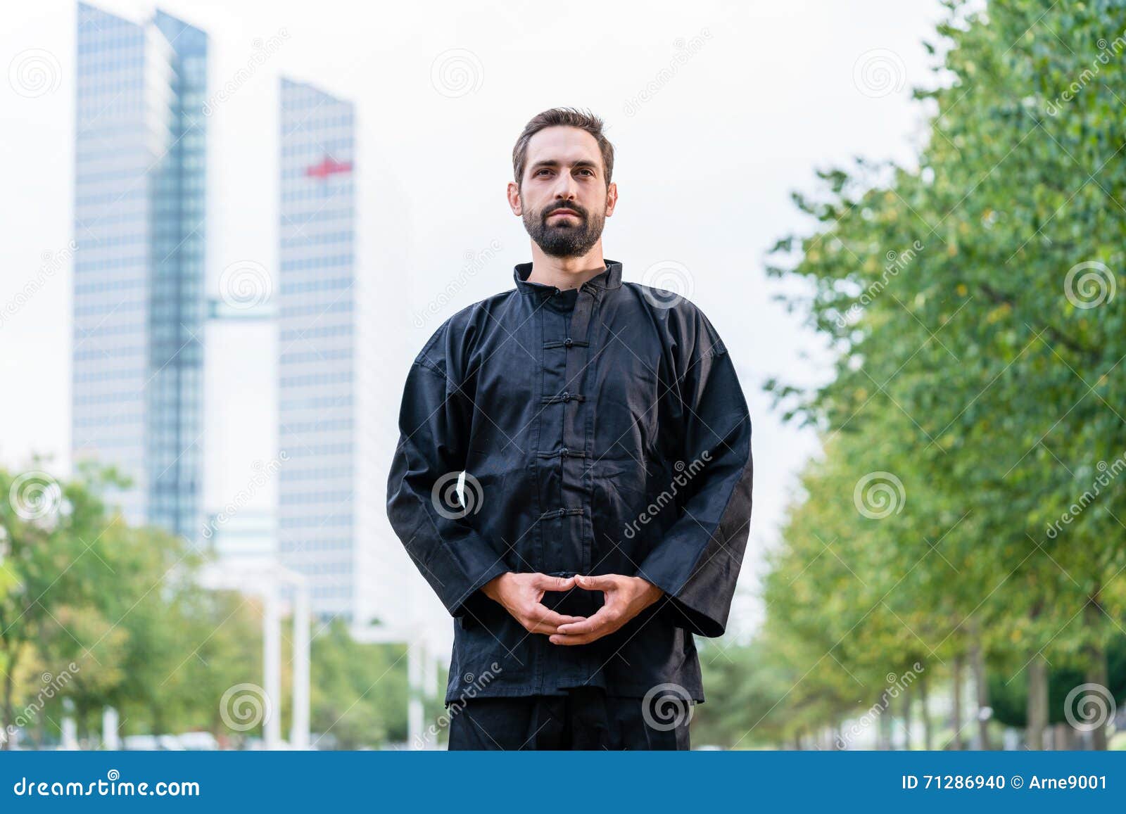 Man Meditating Doing Martial Arts in City Stock Photo - Image of city ...