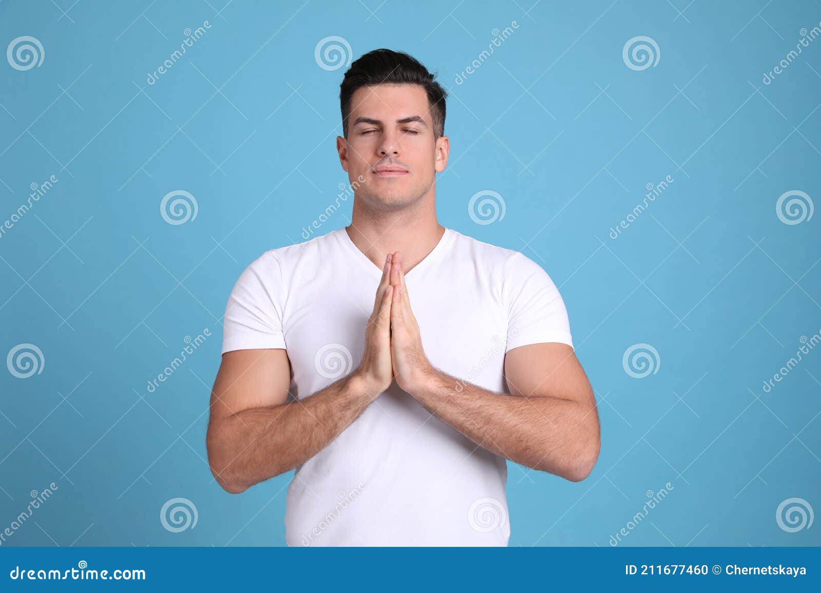 Man Meditating on Light Blue Background. Stress Relief Exercise Stock ...
