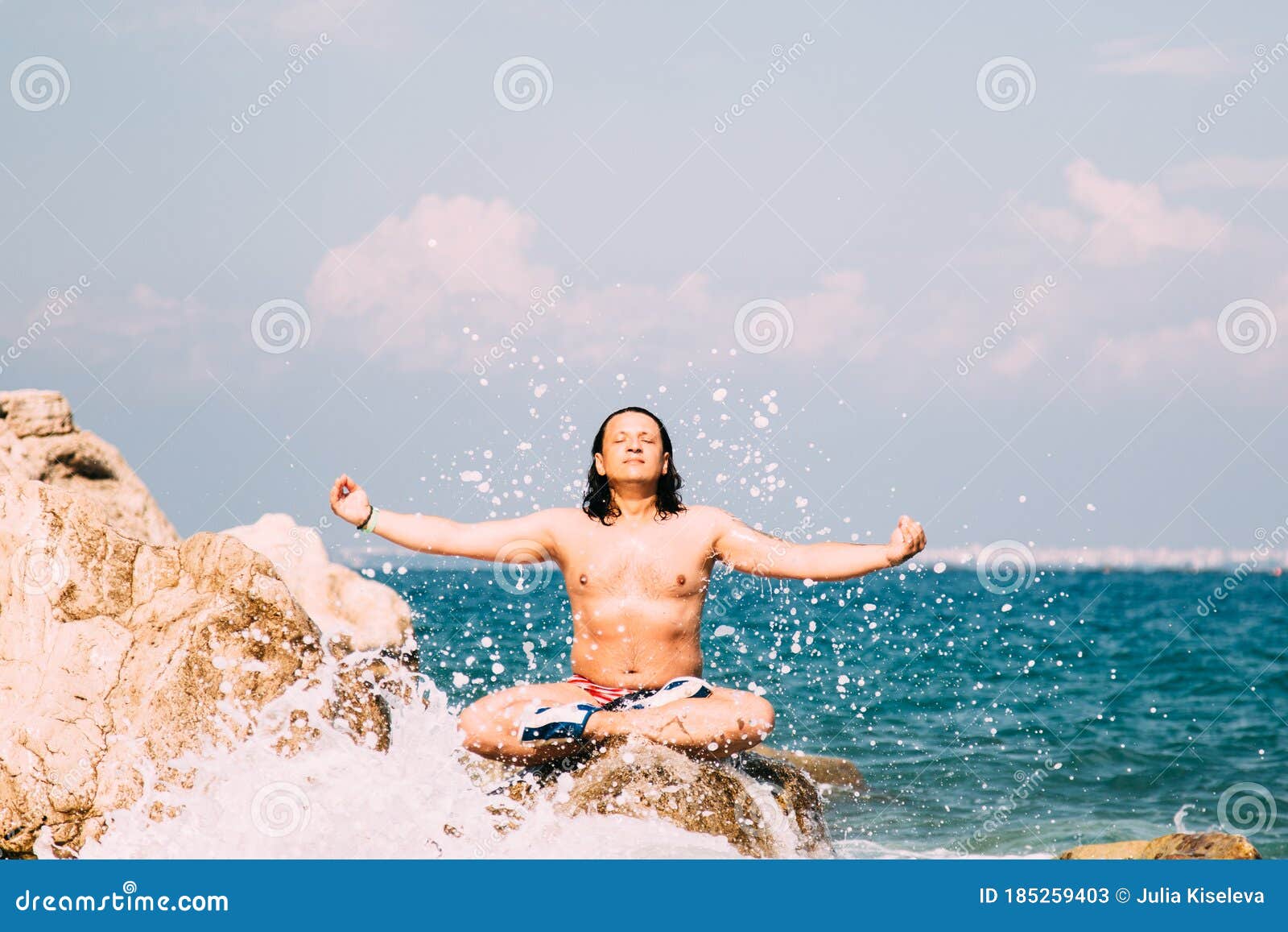 Man Meditating on a Rock at the Sea Stock Image - Image of meditating ...