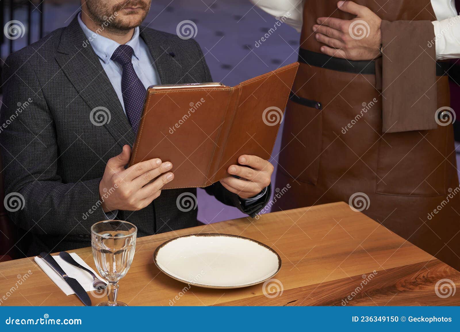 Man with Menu in a Restaurant Taking Order at Table Stock Photo - Image ...
